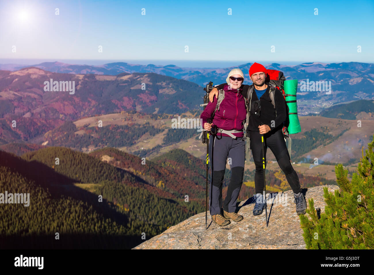 Two Hikers Staying on High Rock and Mountain View with Autumnal Forest ...