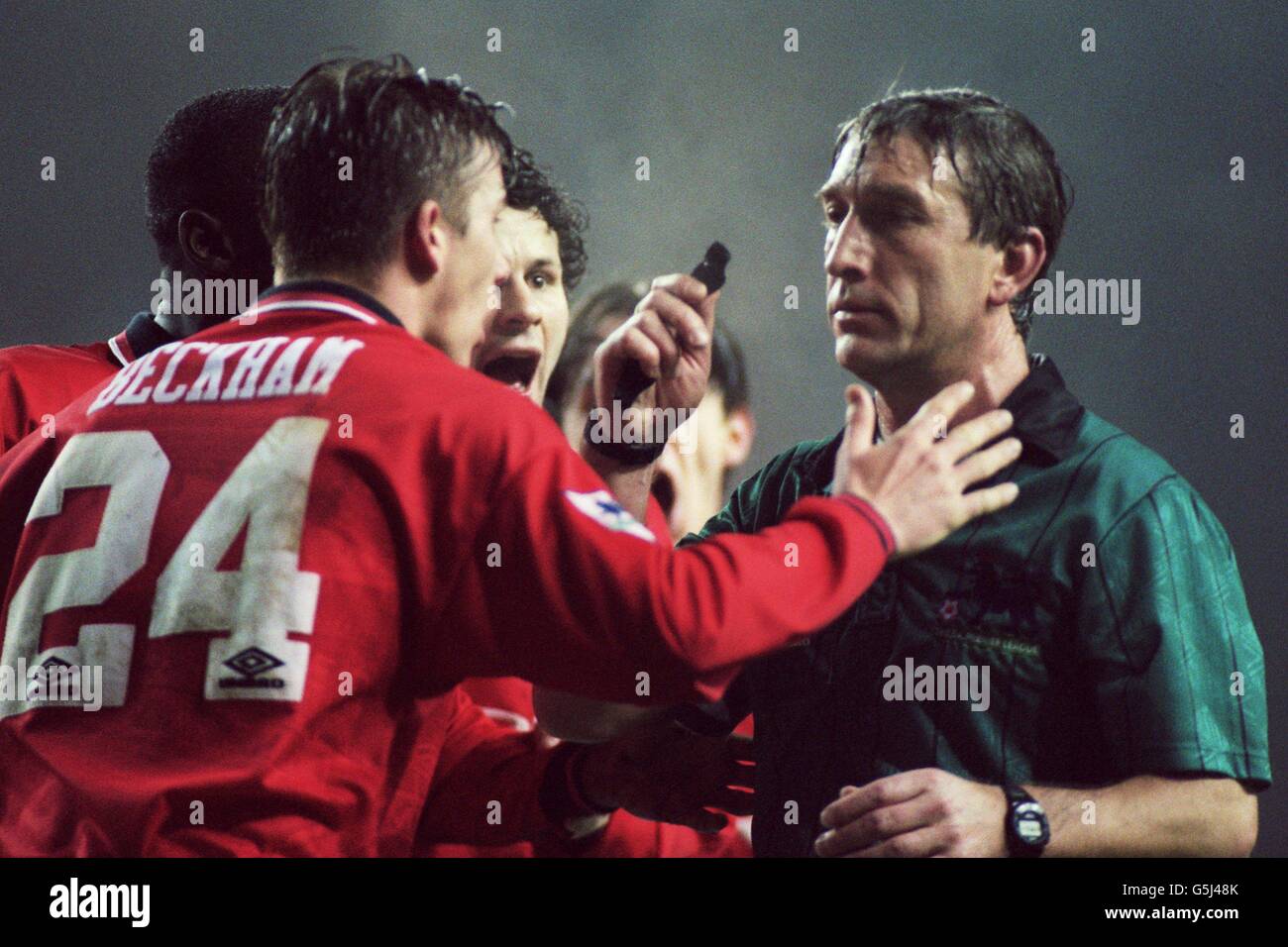 David Beckham, Ryan Giggs and Andy Cole argue with referee Gerald Ashby over disallowed goal ...