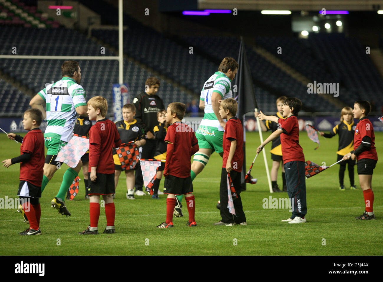 Edinburgh Rugby mascots form a guard of honour for the players before ...