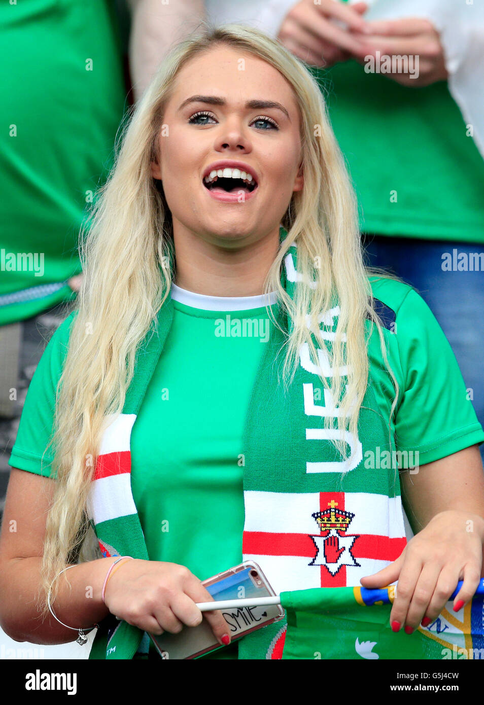 A Northern Ireland fan shows her support in the stands before the UEFA ...
