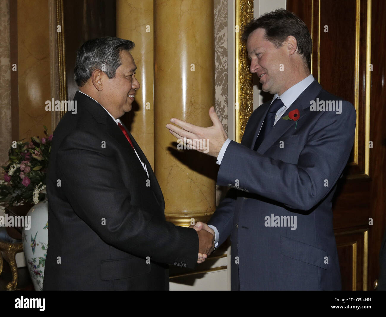 Indonesia's President Susilo Bambang Yudhoyono shakes hands with Deputy ...
