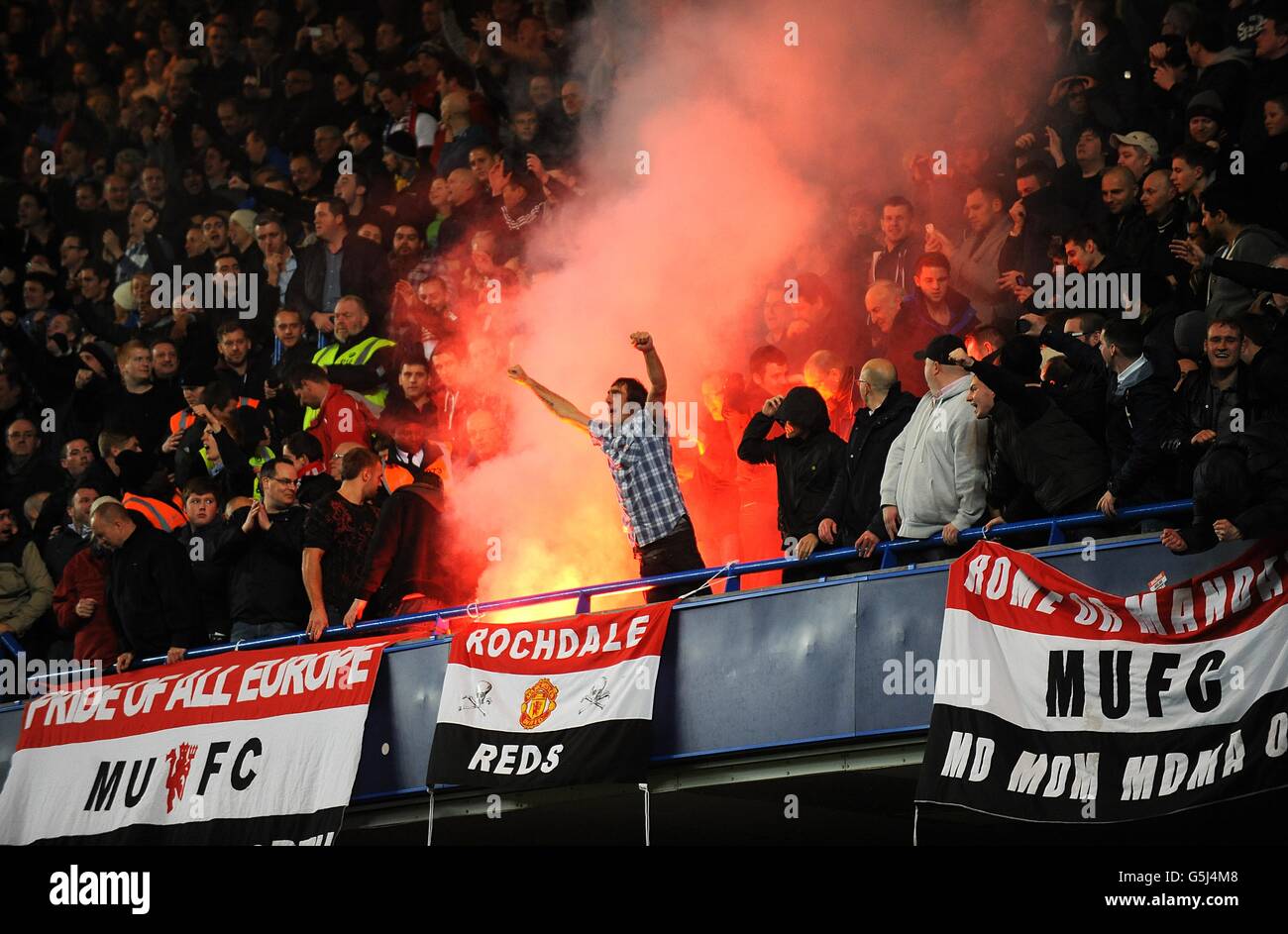 Chelsea fans let off a flare in the stands hi-res stock photography and ...