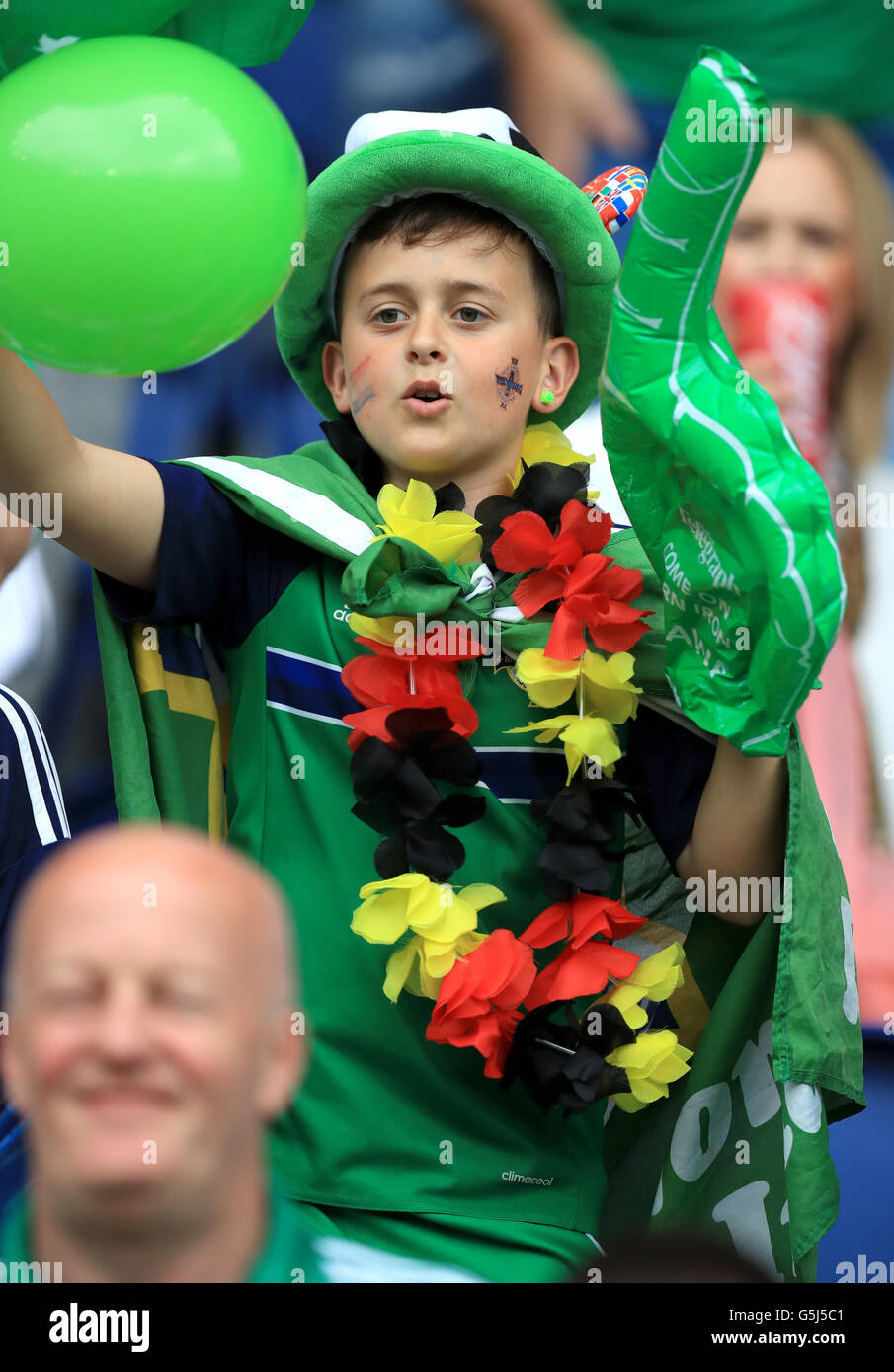 A young Northern Ireland fan cheers on his side in the stands before ...