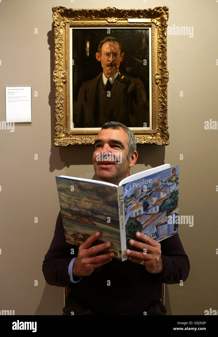 Guy Peploe grandson of SJ Peploe beside a self portrait of the artist ...