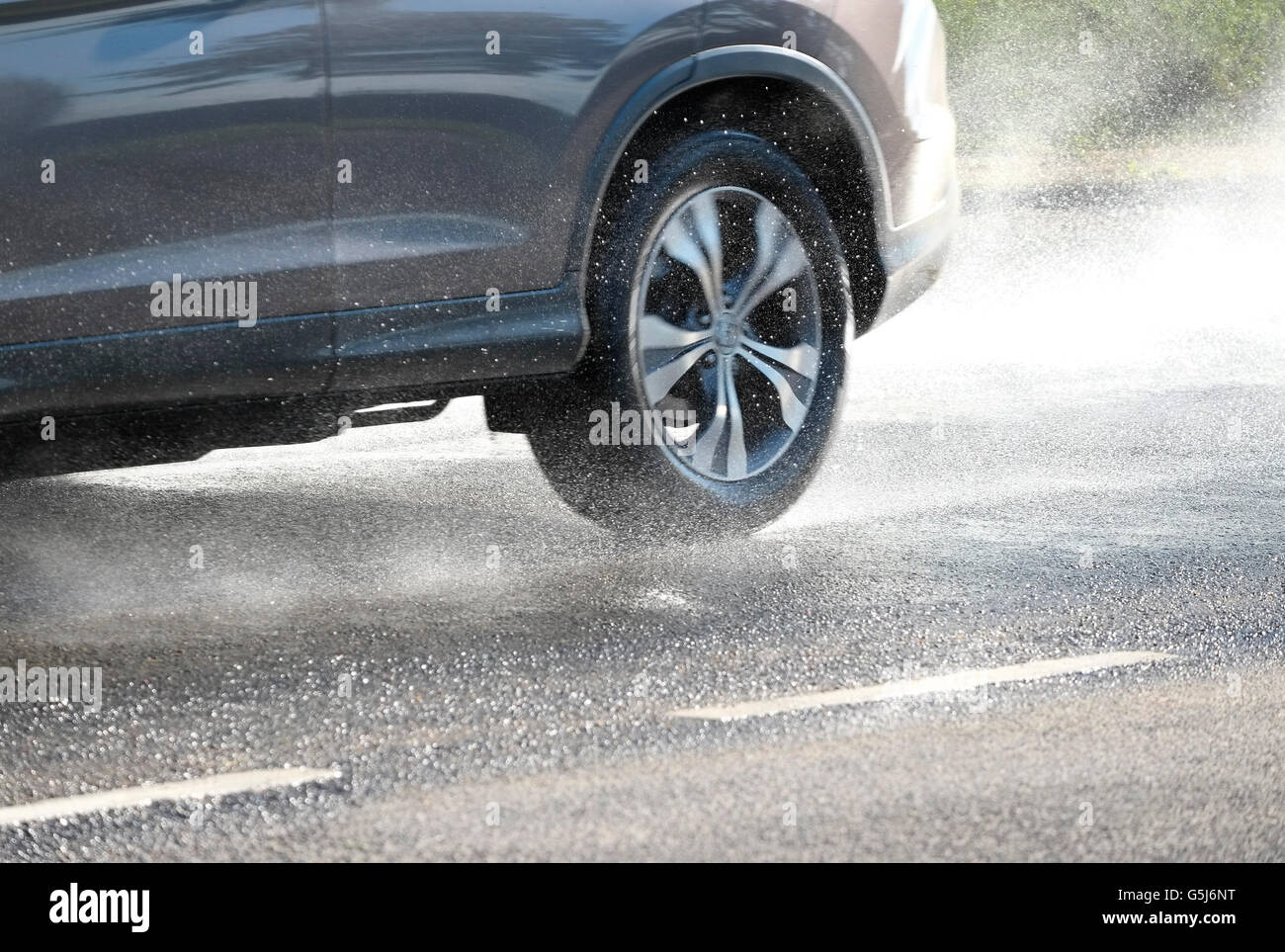 Cars driving on wet road hi-res stock photography and images - Alamy