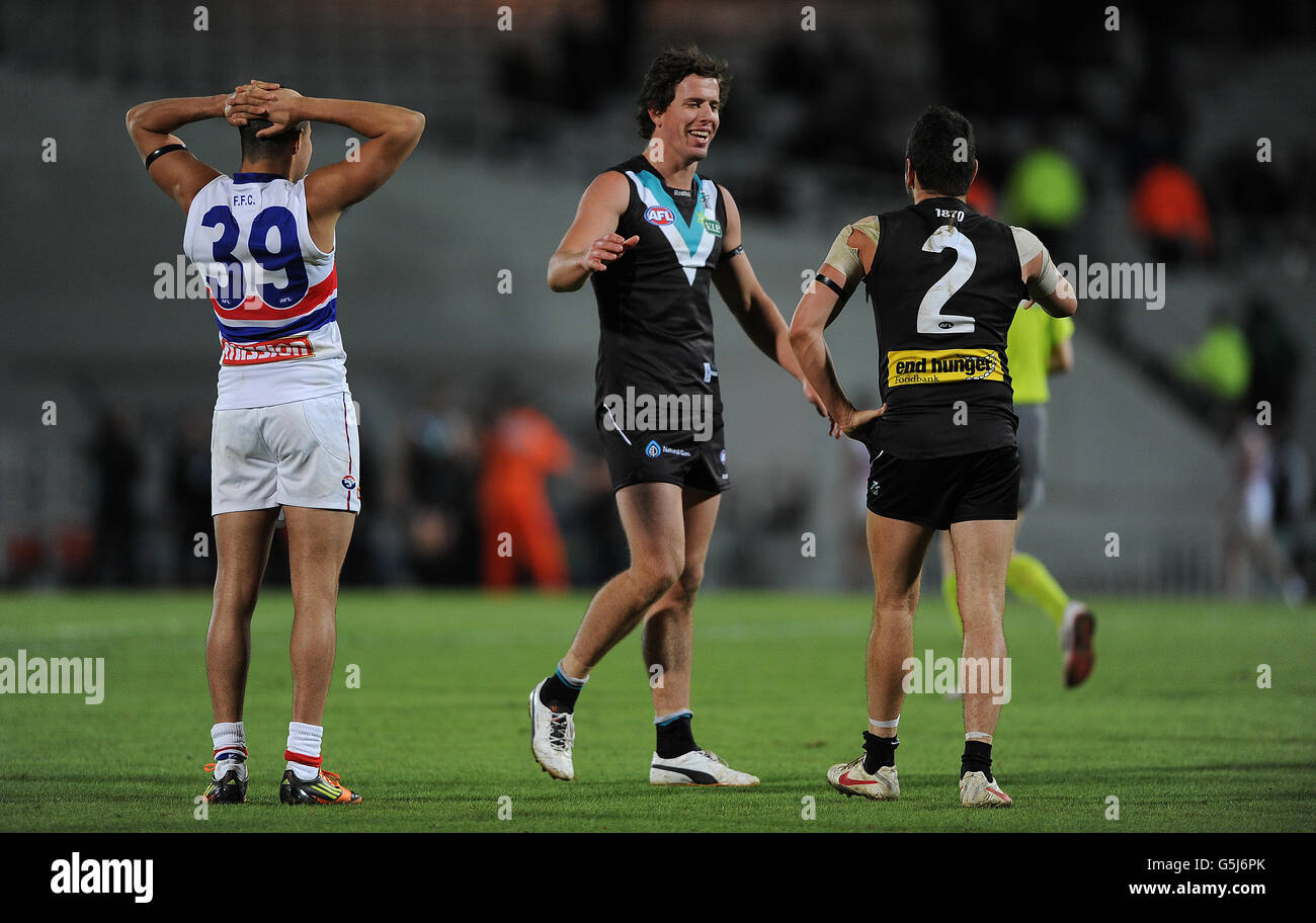 Port Adelaide's Nick Salter (centre) and Cameron Hithcock (right ...