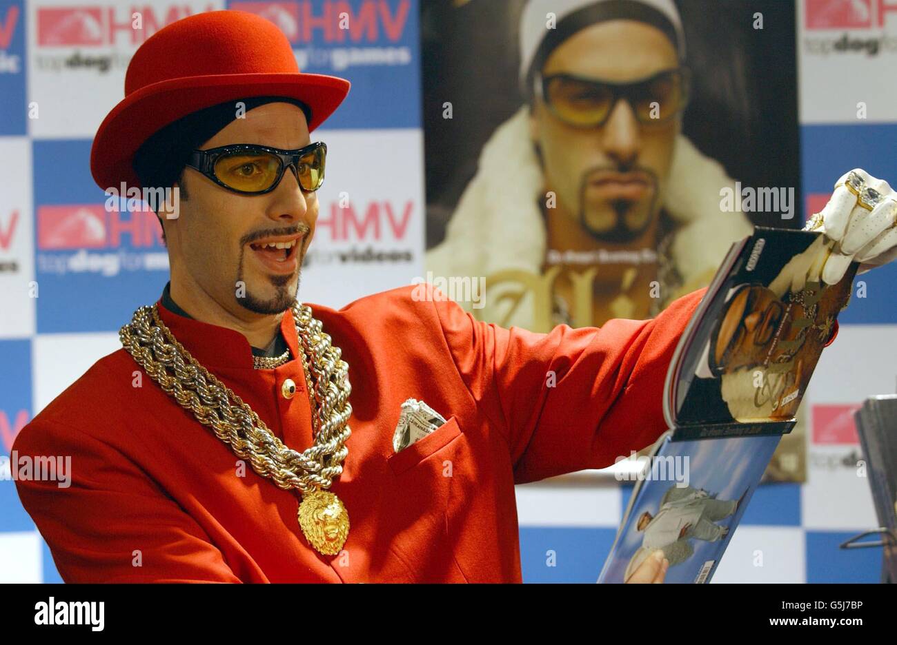 Comic Ali G poses with a copy of his book 'Da Gospel According To Ali G ...
