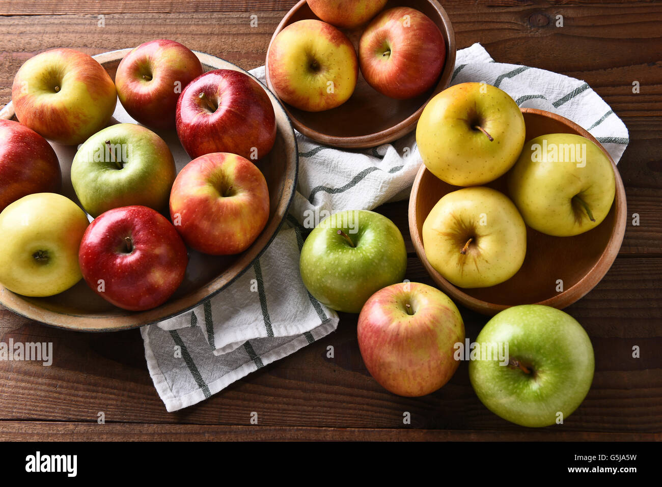 High angle still life of a group of fresh picked varieties of apples ...