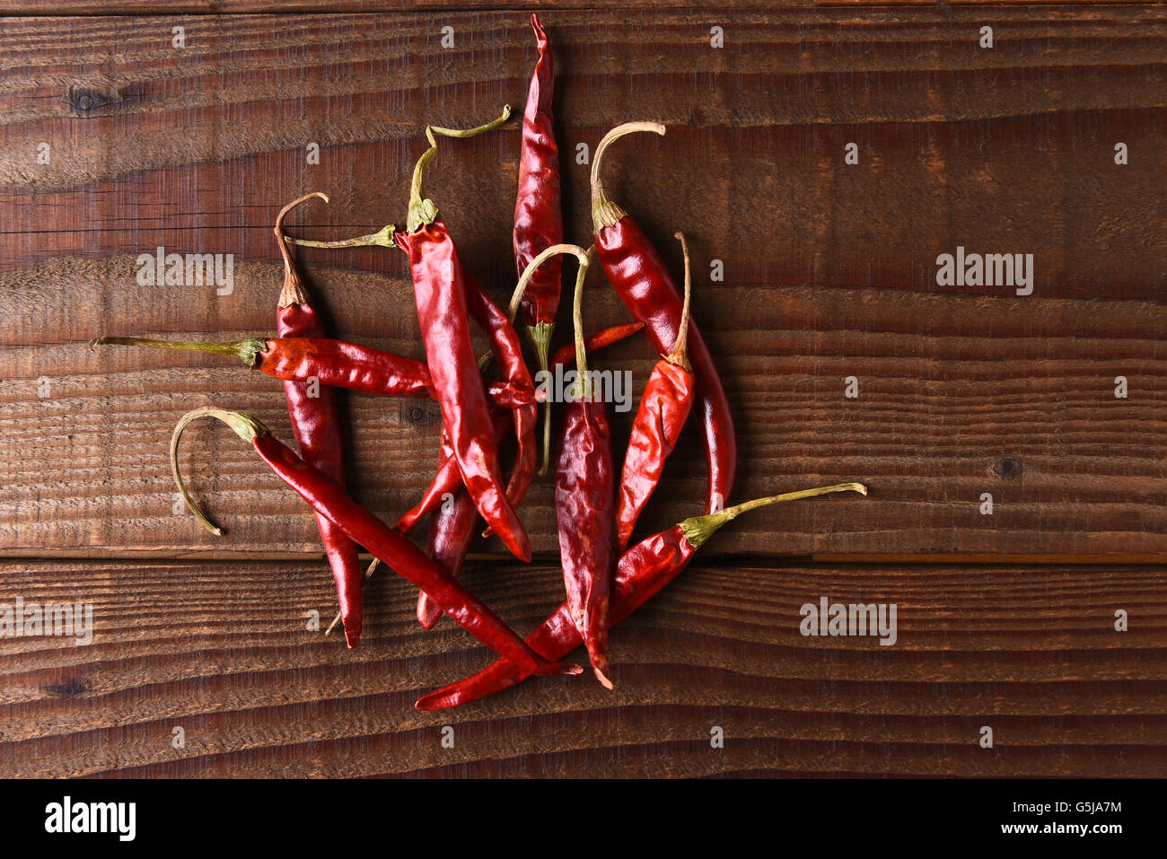 Dried Chili Still Life. Horizontal format on a rustic wood table with ...