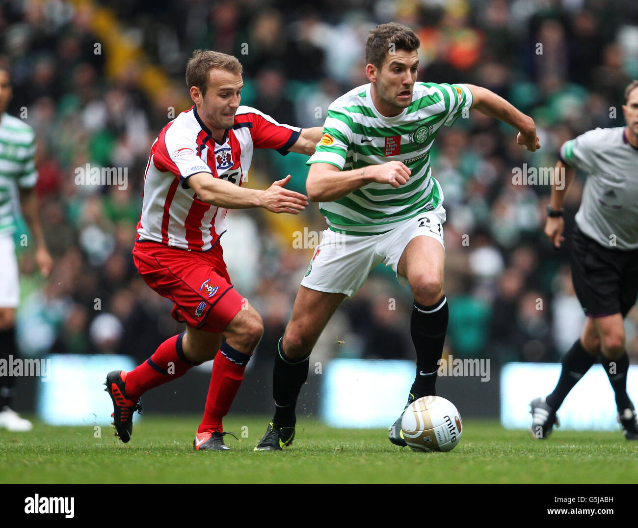 Kilmarnock's Liam Kelly and Celtic's Charlie Mulgrew (right) battle for ...