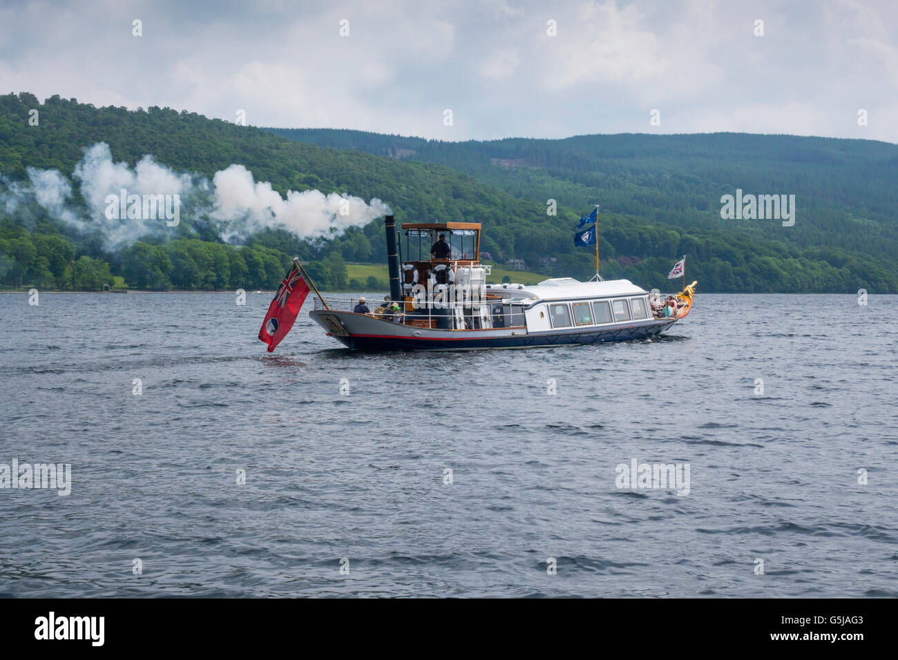 The historic Steam Yacht Gondola leaving Coniston Pier in the English ...