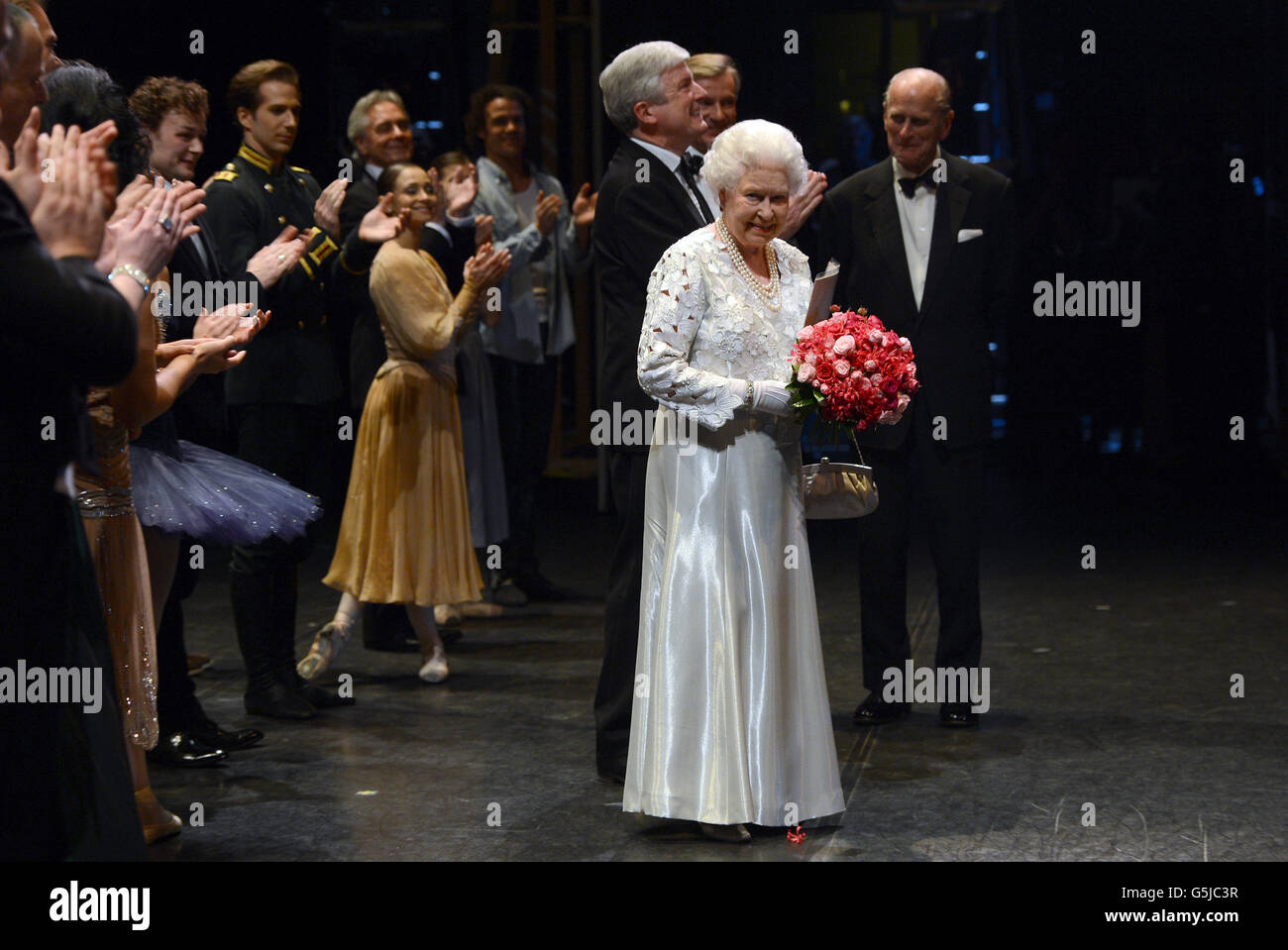 Queen Elizabeth II receives applause following the national anthem ...