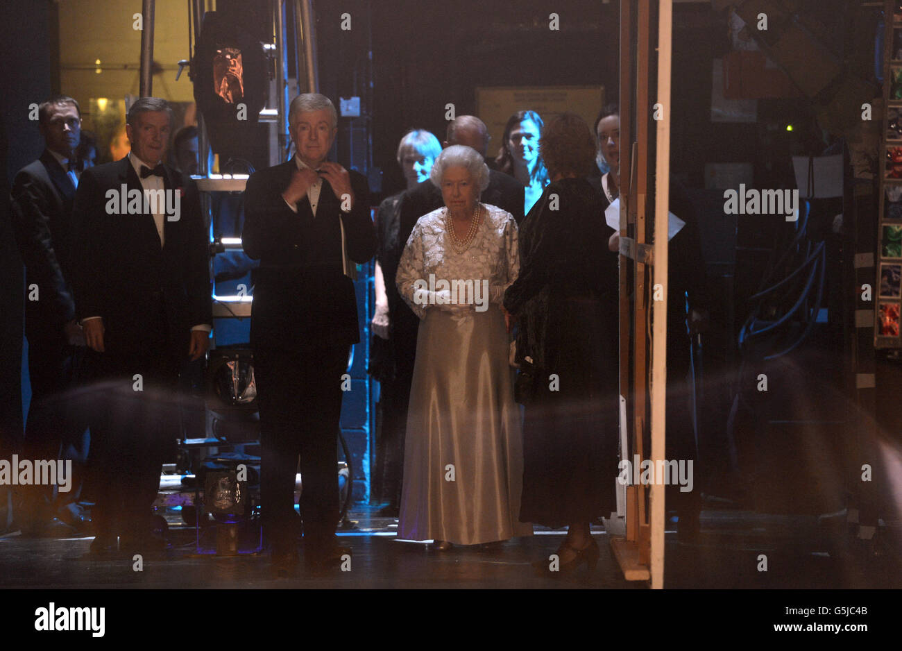 Queen Elizabeth II and the Duke of Edinburgh wait backstage prior to ...
