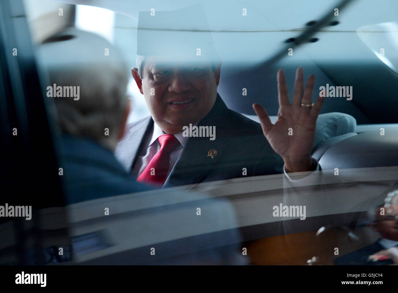 Indonesian President Susilo Bambang Yudhoyono waves as he leaves the ...