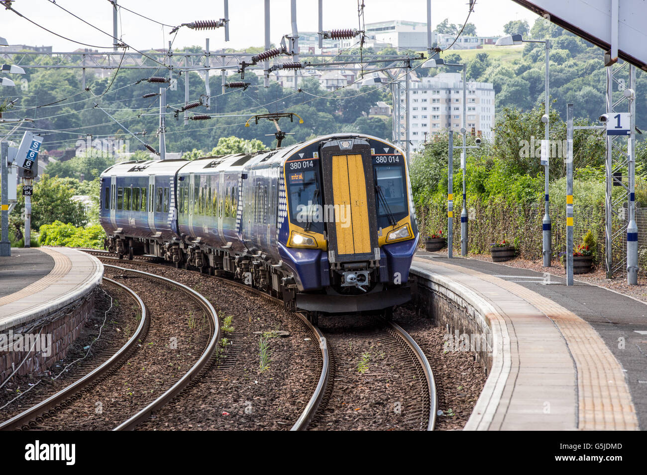 A Class 380 electric train pulls into Fort Matilda train station Stock ...