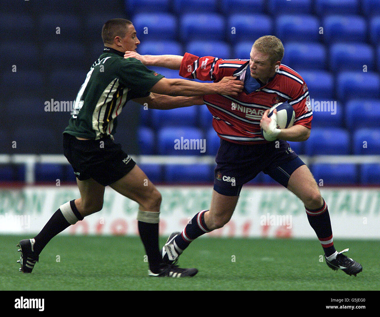 London Irish's Rob Hoadley tackles Gloucester's Josh Frape during the ...
