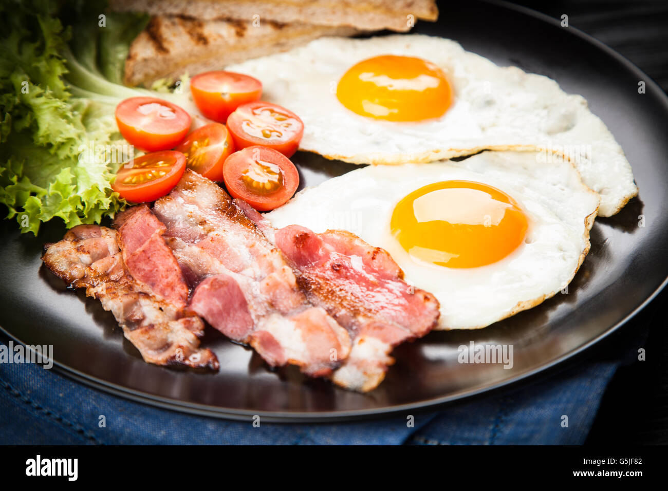 Traditional breakfast on a plate Stock Photo - Alamy