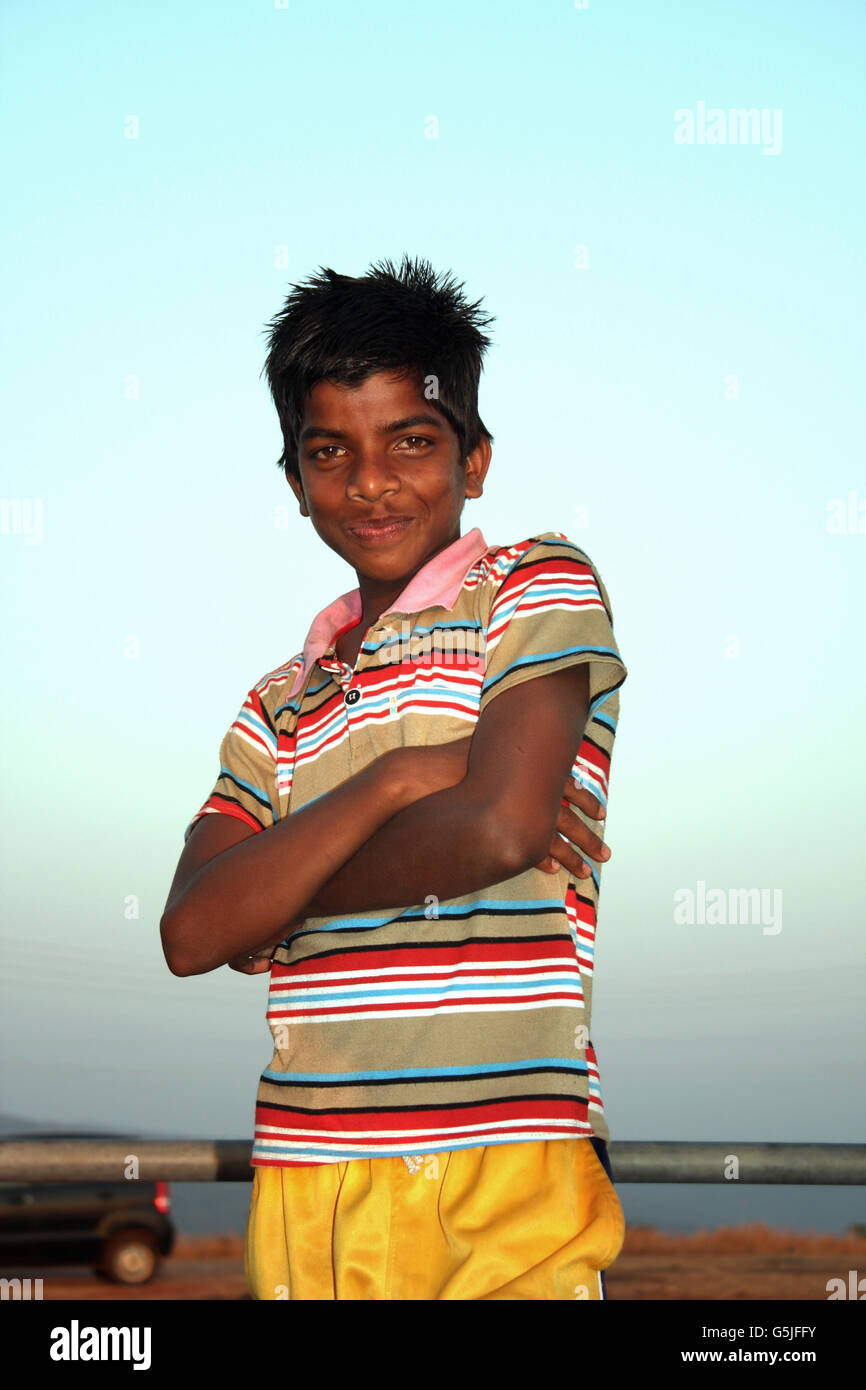 A poor Indian village boy striking a pose, in the outdoors Stock Photo ...