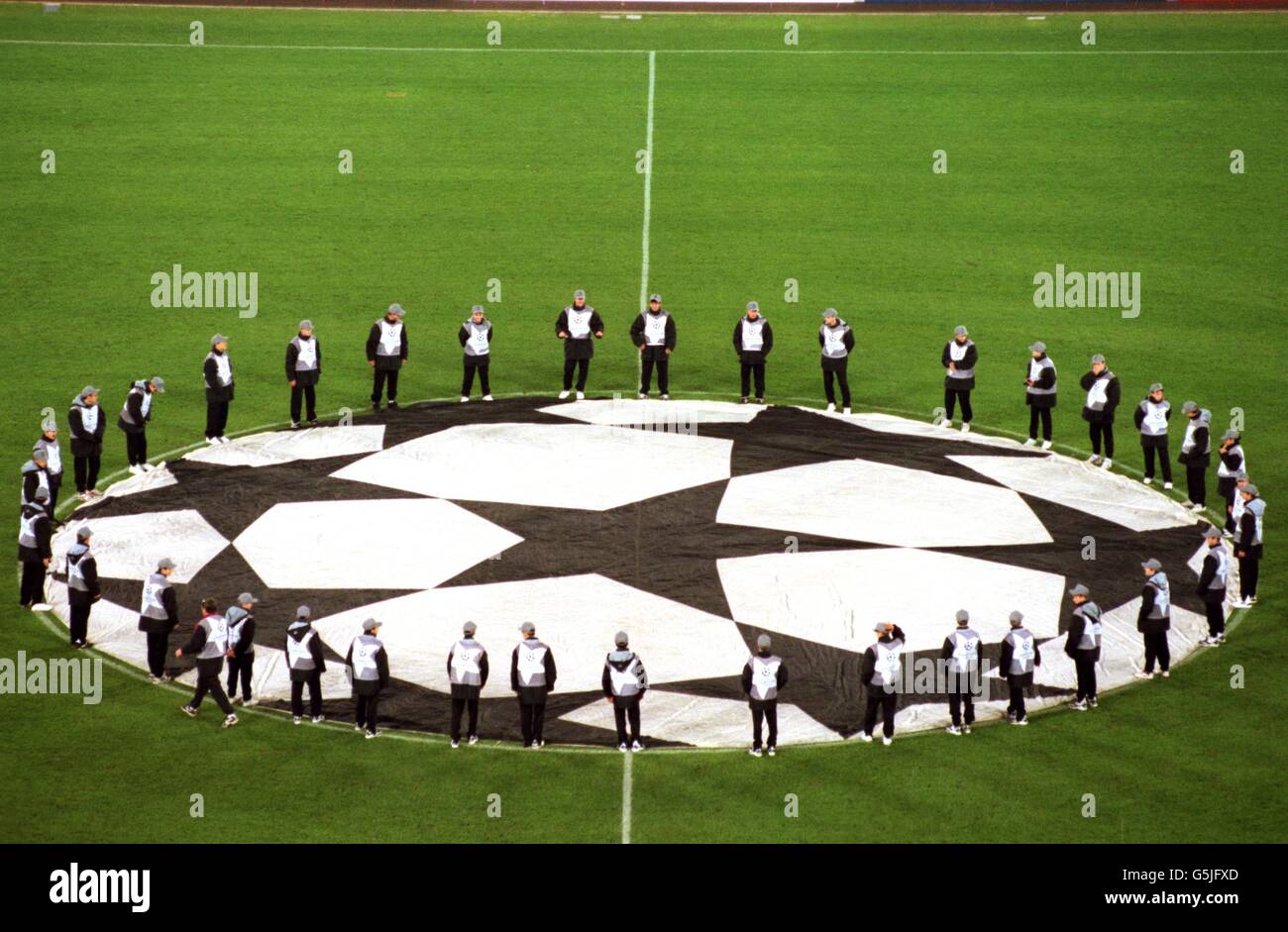 Champions league centre circle and ball boys hi-res stock photography ...