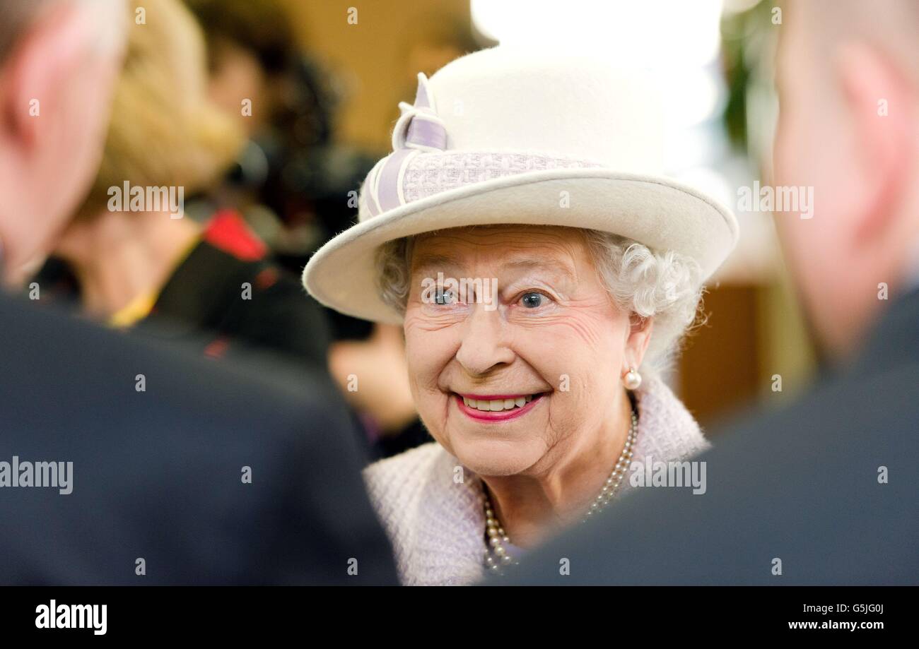 Queen Elizabeth II meets members of staff at The Poppy Factory as she ...