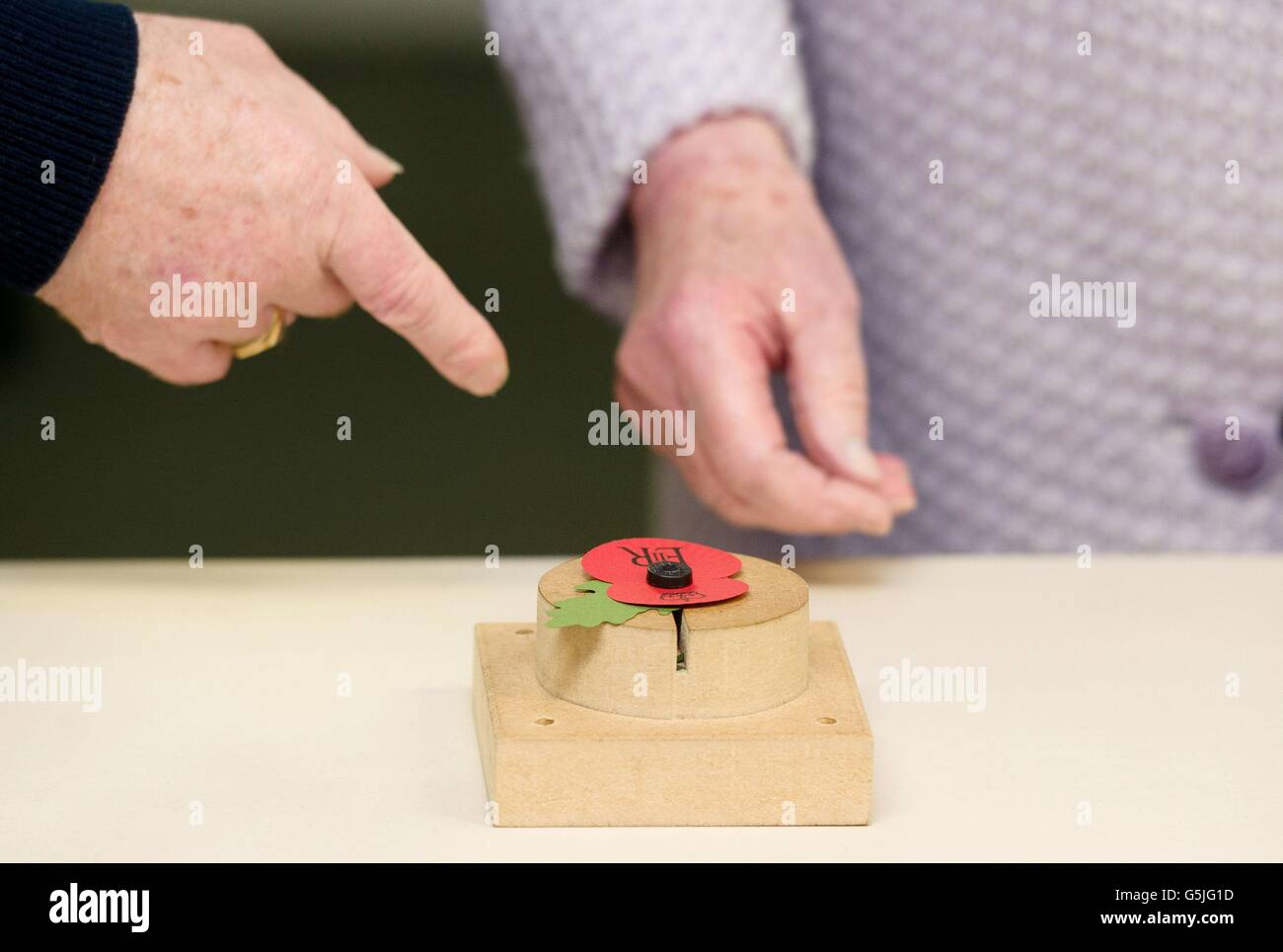 Queen visits Poppy Factory Stock Photo - Alamy