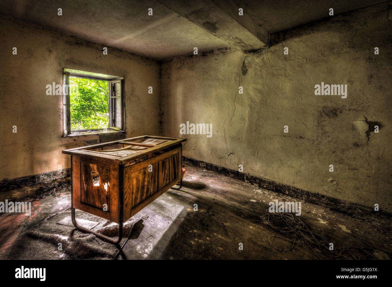 Decaying desk in an abandoned office Stock Photo - Alamy