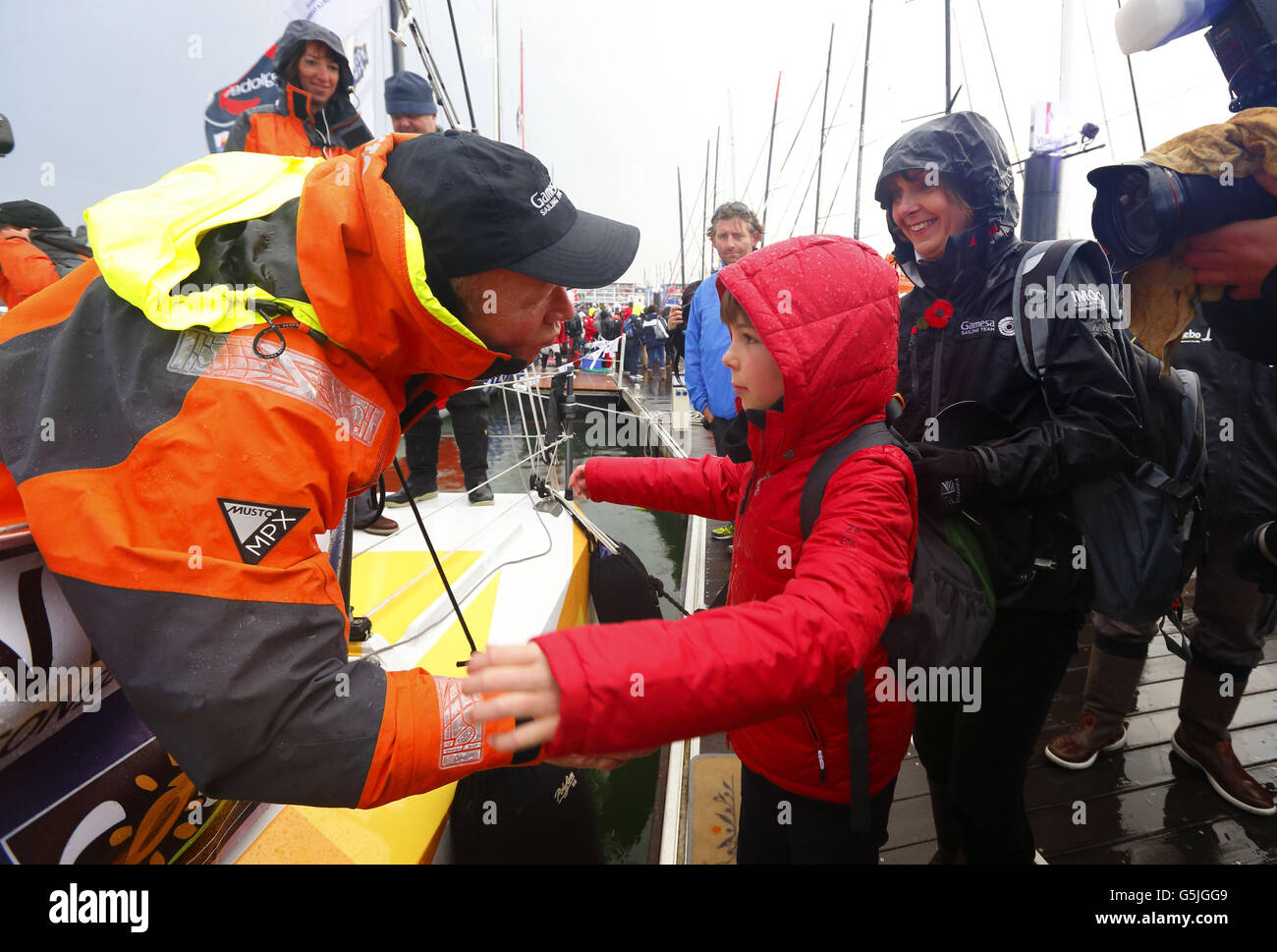 British yachtsman Mike Golding (left) says goodbye to son Soren and ...
