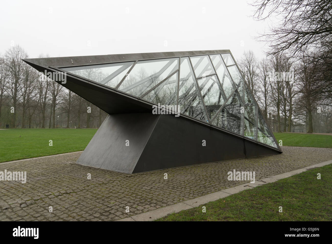 Reflection of trees in metal and glass structure in park Stock Photo ...