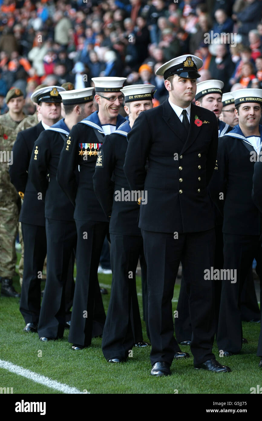 Members of the armed forces on the pitch before kick-off on Remembrance ...