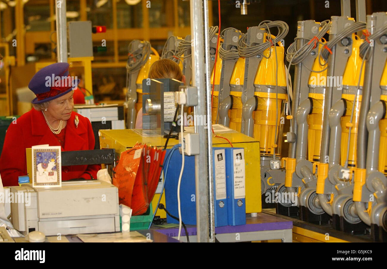 The Queen looks at a row of vacuum cleaners at the Dyson factory in ...
