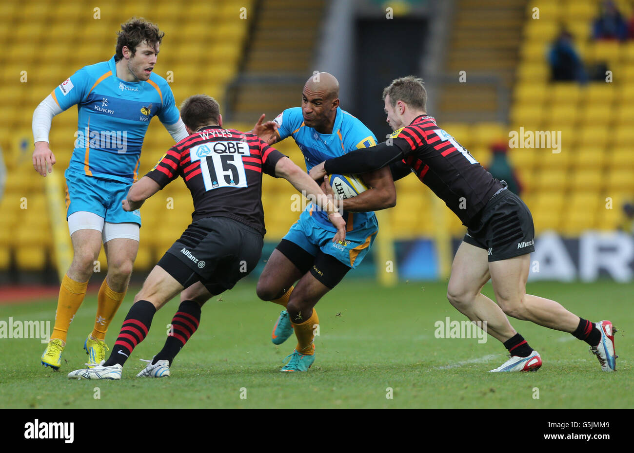 London Wasps' wing Tom Varndell runs in to Saracens pair James Short ...