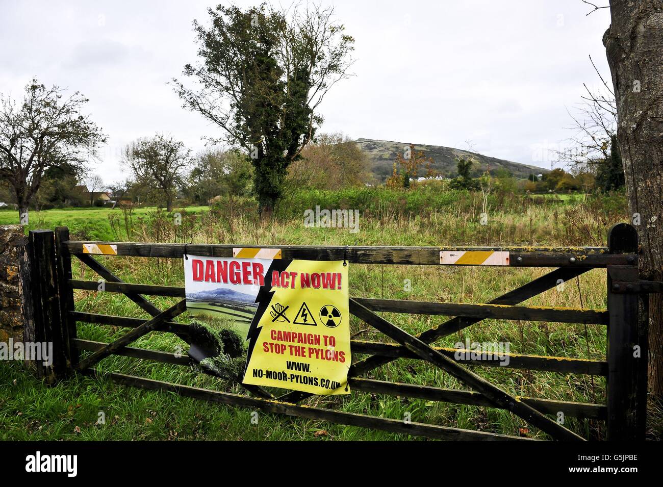 An anti-pylon campaign poster on the side of a fence in the village of ...