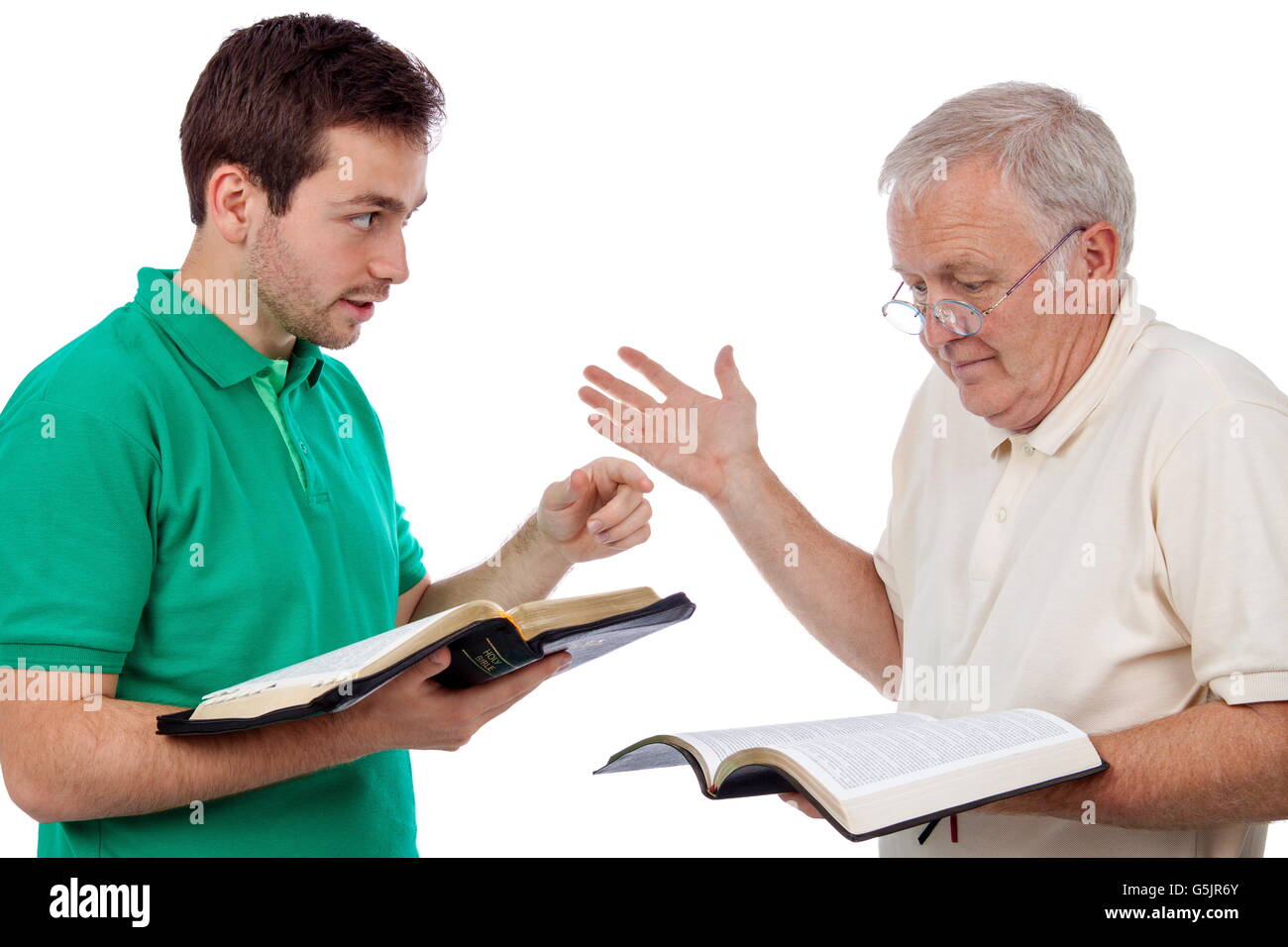 Young man sharing God's Words with an old man Stock Photo - Alamy