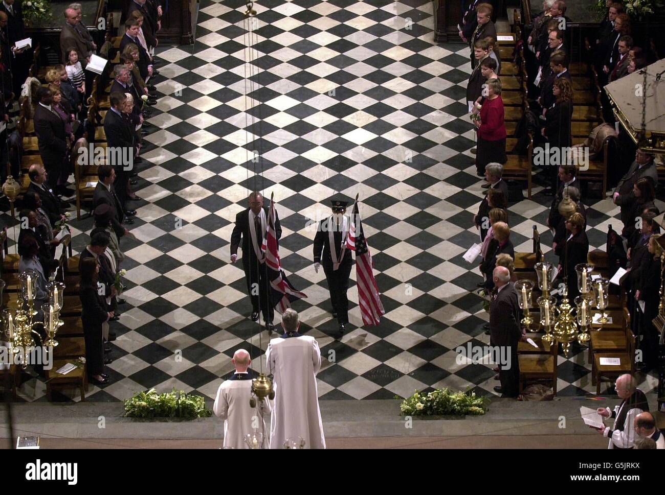 The British, left, and American flags are carried towards the altar in ...