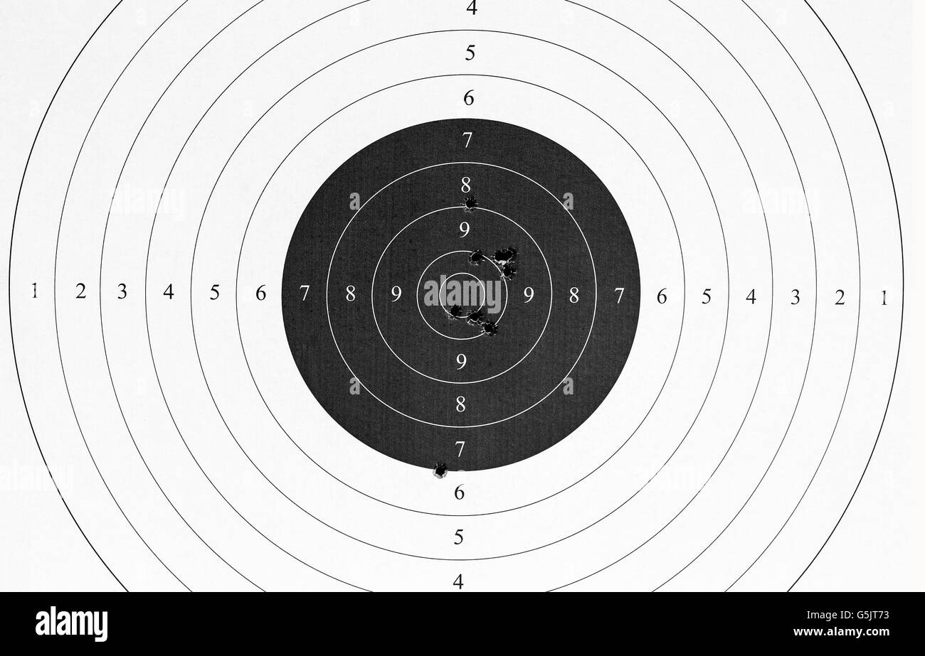Used paper target with bullet holes Stock Photo - Alamy