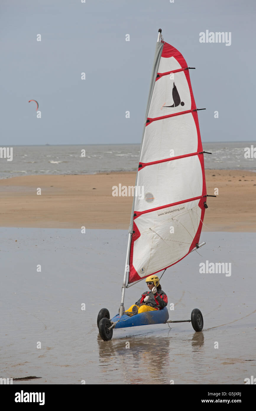 Single red white sand yacht land sailing on beach La Barre-de-Monts ...