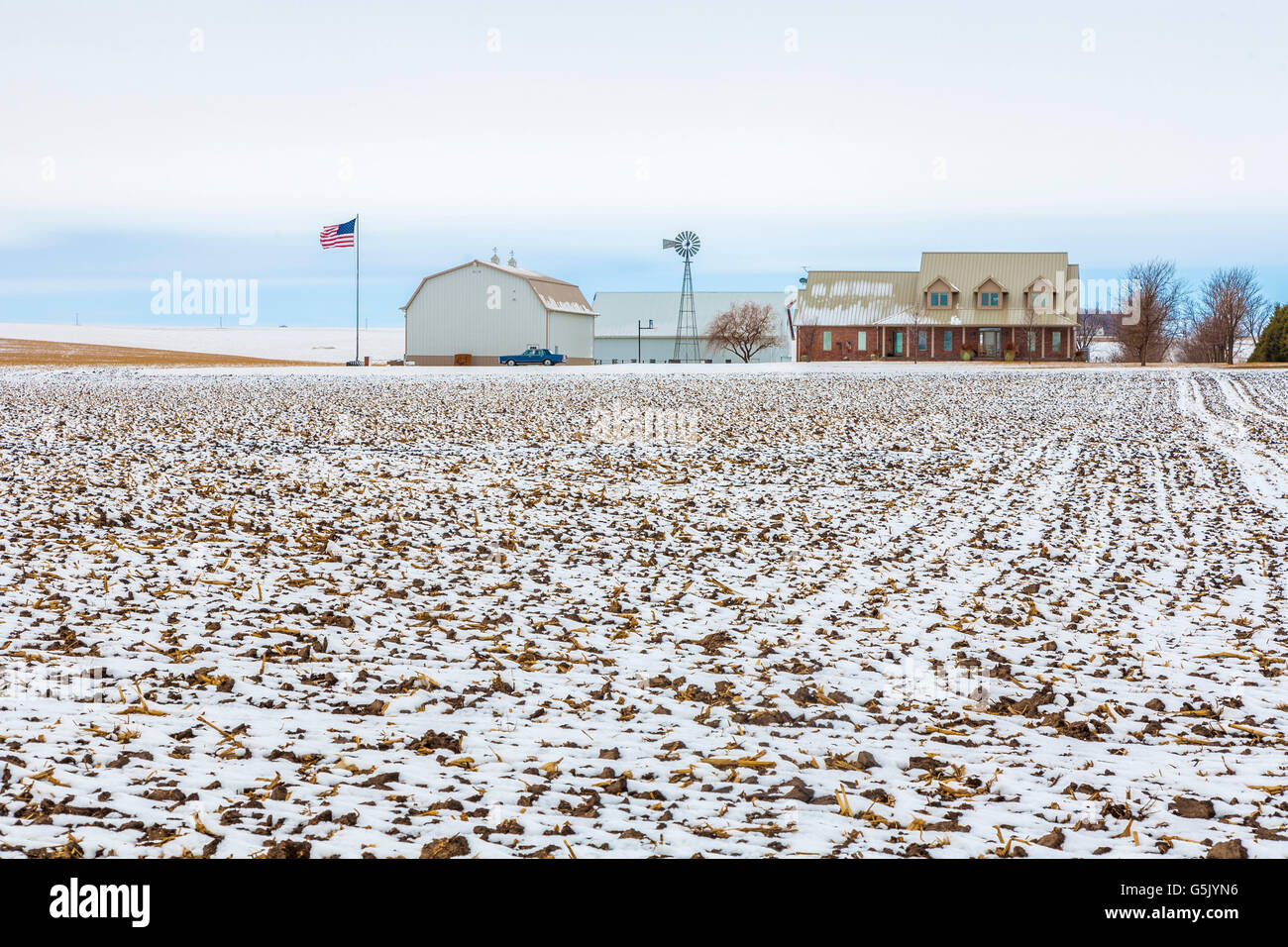 Grain fields on family farm dusted in light snow in rural north east ...