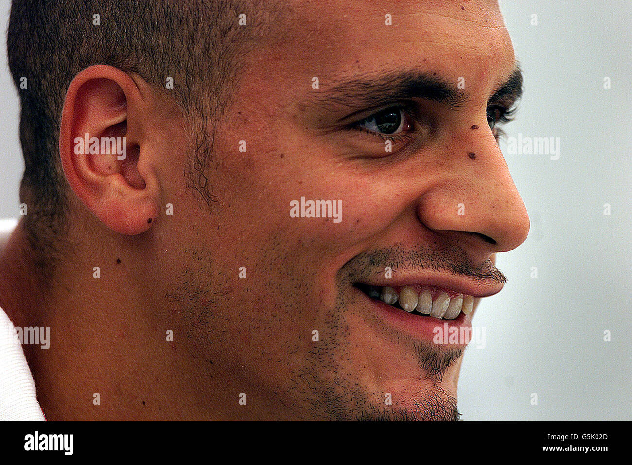 Sport football head head shot teeth smiling rio ferdinand hi-res stock ...