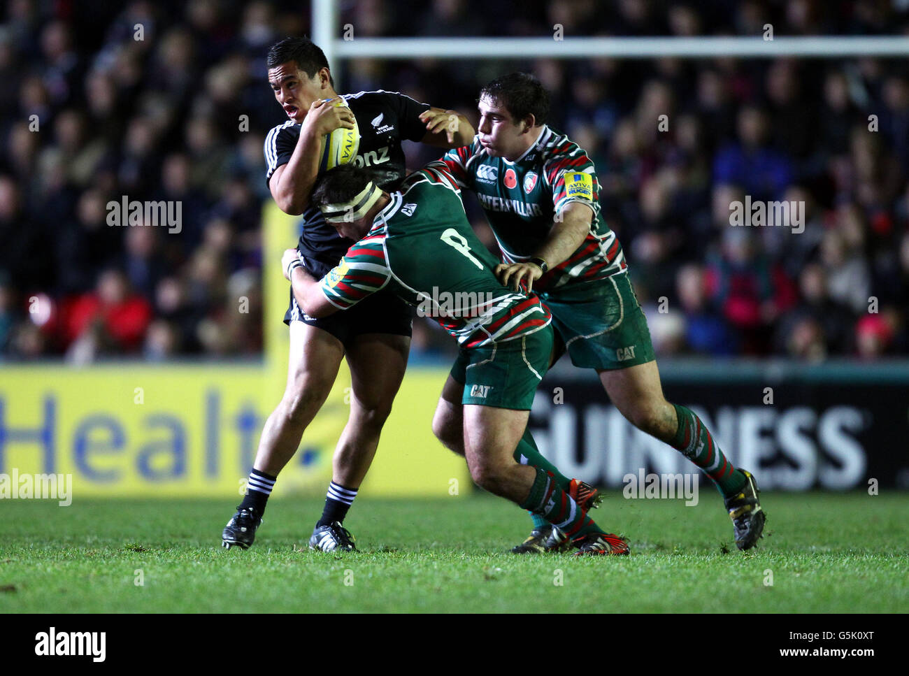 Maori All Blacks' Quentin MacDonald is caught by Leicester Tigers ...
