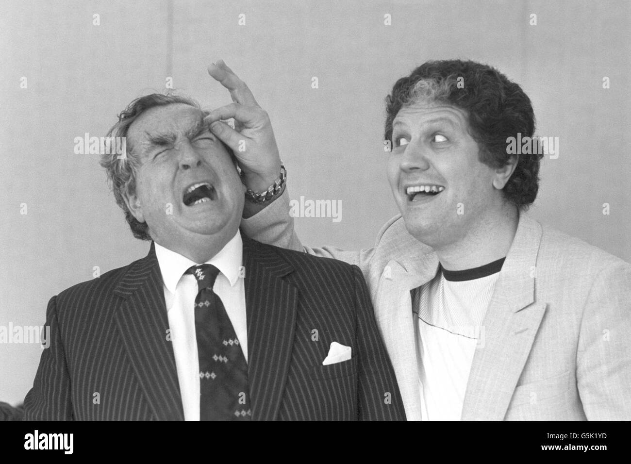 DJ Dave Lee Travis pulls the famous eyebrows of Shadow Foreign ...