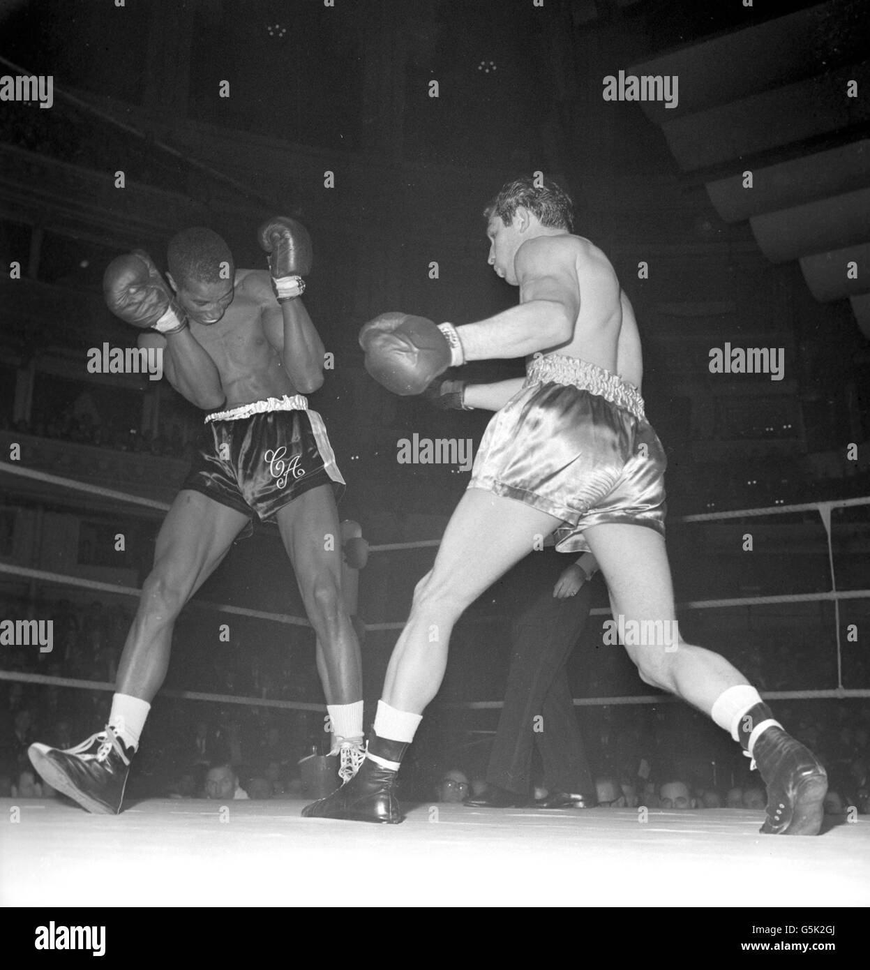 Boxer hitting his opponent Black and White Stock Photos & Images - Alamy