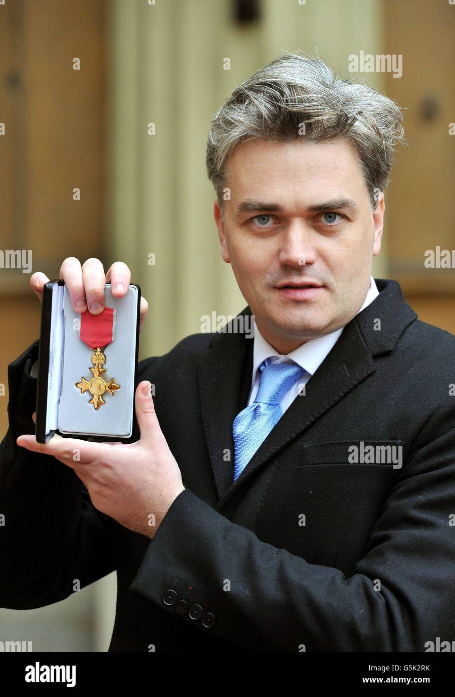 Edward Gardner of the English National Opera proudly holds his Officer ...