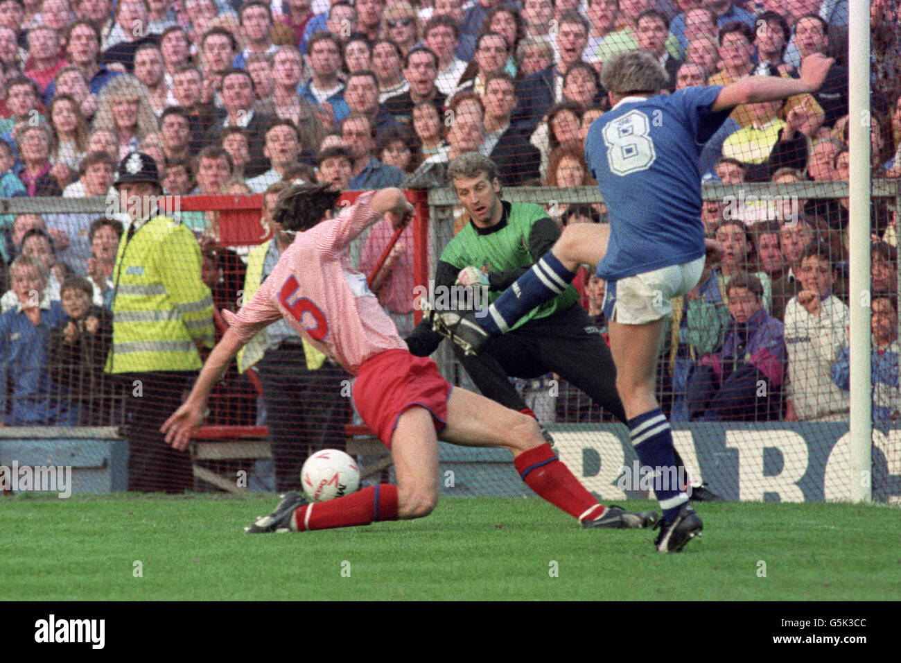 Millwall striker John McGinley (right) scores through the legs of ...