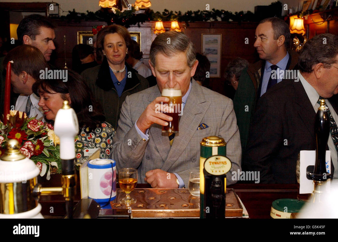 The Prince of Wales samples a pint of Thwaites Bitter during a visit to ...