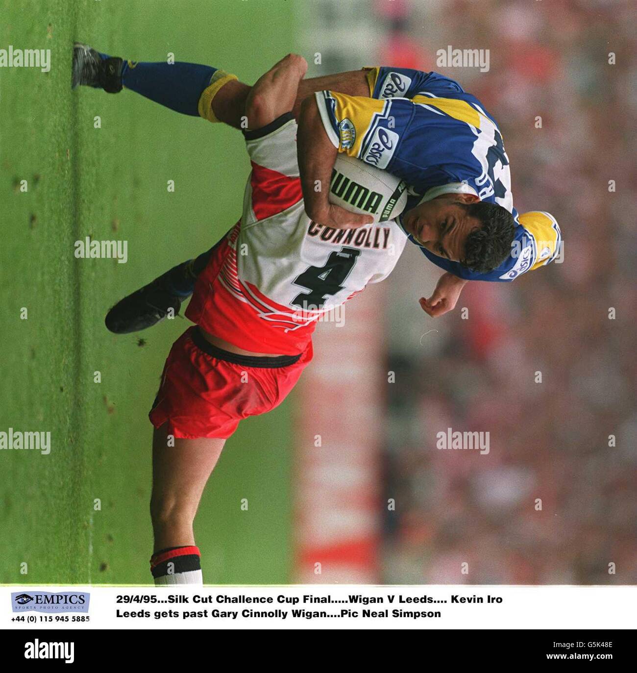 Kevin iro of leeds gets past gary cinnolly of wigan hi-res stock ...