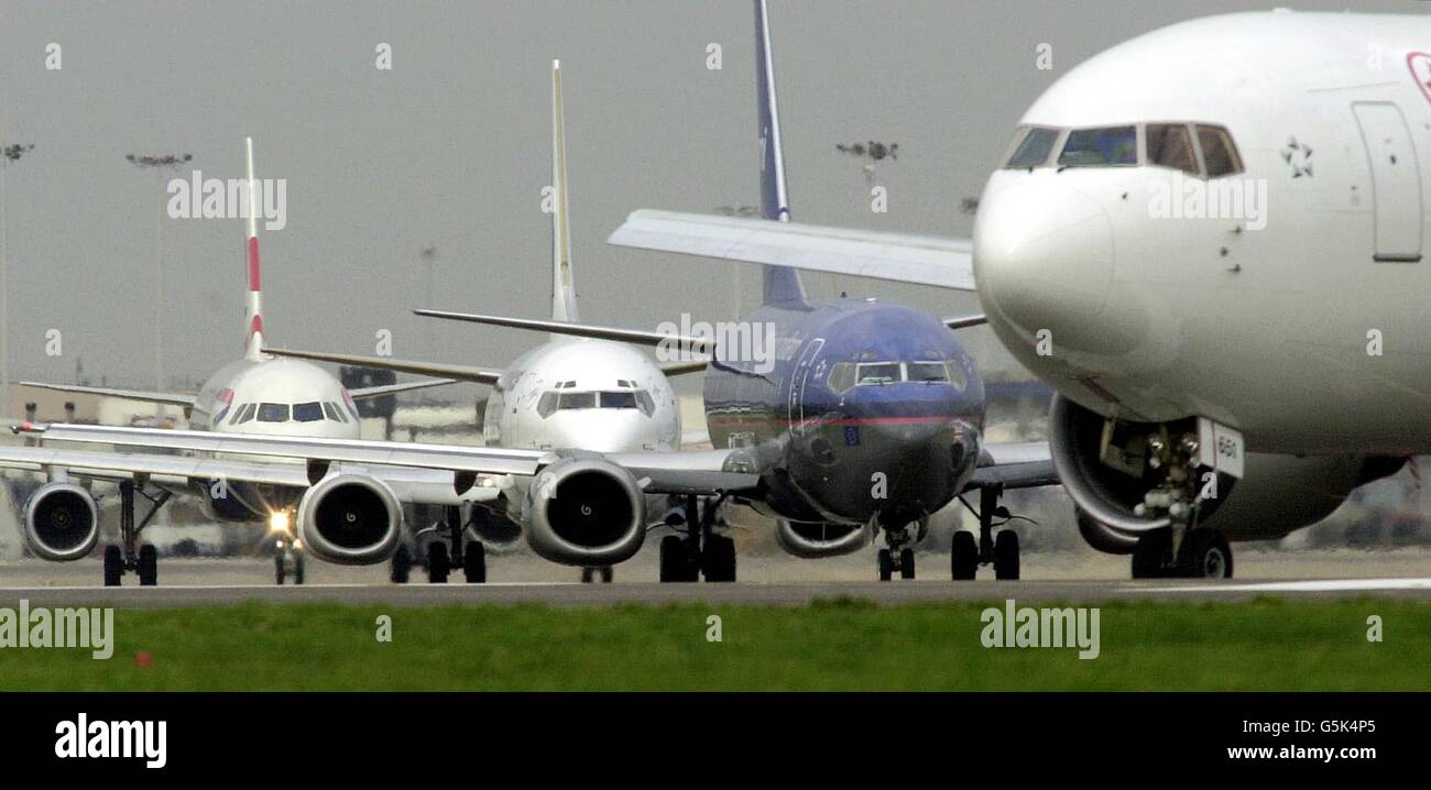 Aircraft queuing for take-off at Heathrow Airport. Transport Secretary ...