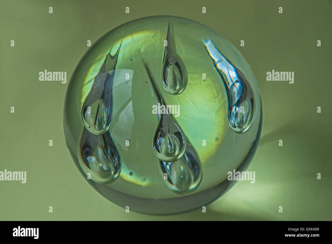 Glass Transparent Sphere with silver bubbles on green background Stock ...