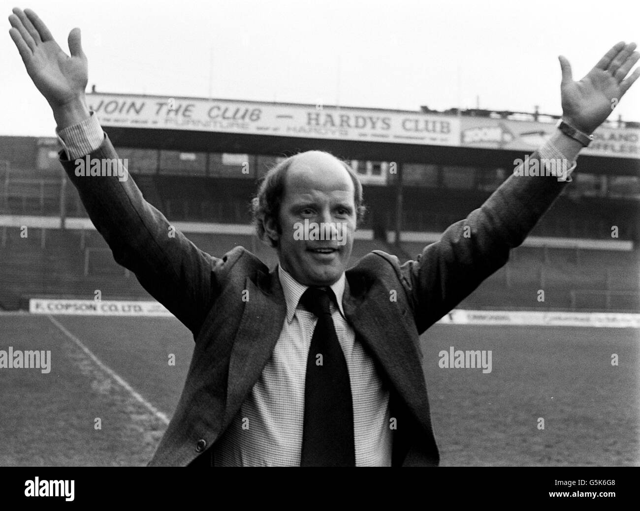 Football 1 2 half length hands in air smiling suit tie hi-res stock ...