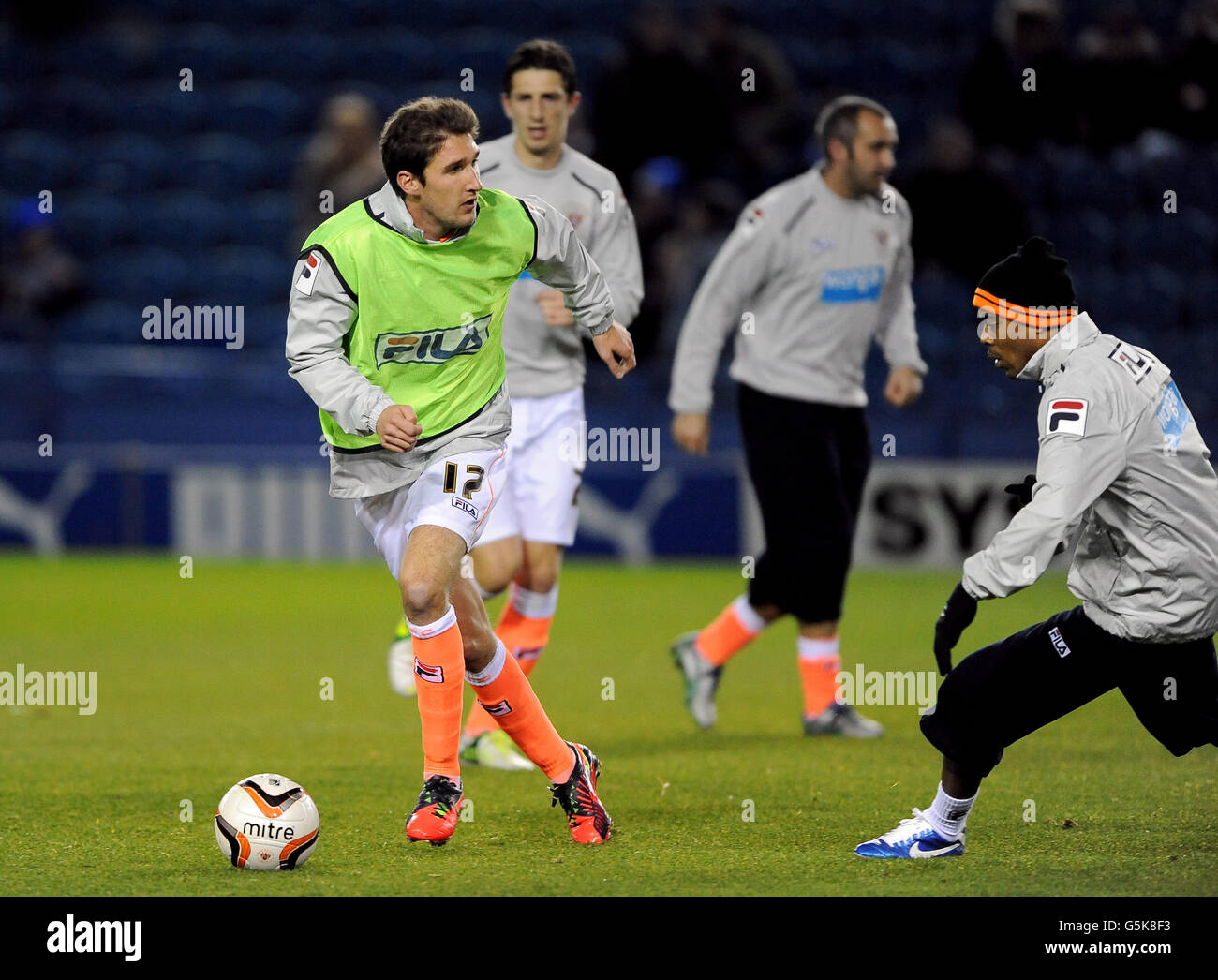 Blackpool's Chris Basham and his team-mates warm up before the game ...