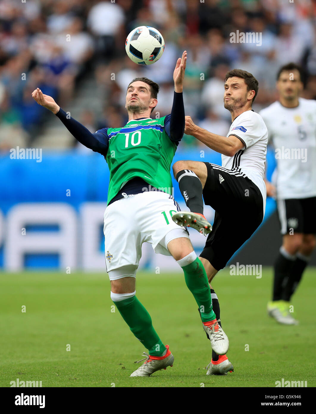 Northern Ireland's Kyle Lafferty (left) and Germany's Jonas Hector ...